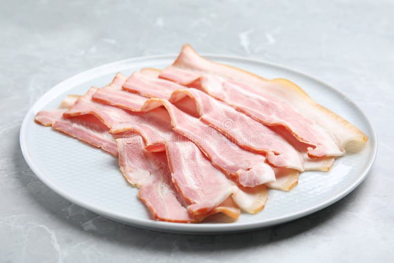 Plate of Sliced Raw Bacon on Grey Marble Table Stock Image - Image of ...