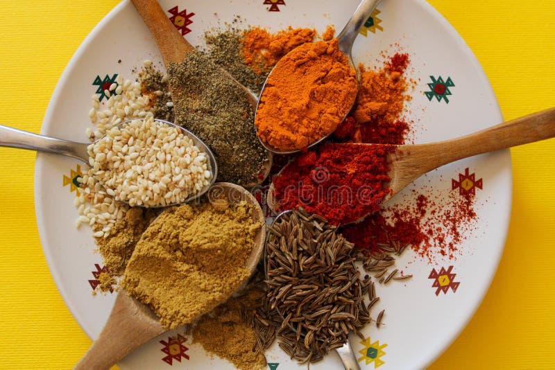 Plate with Spoons of Spices Stock Photo - Image of meal, cuisine: 228423218
