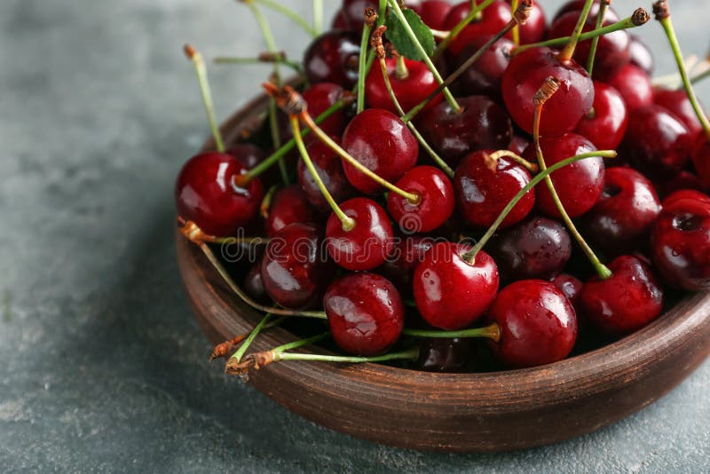 Plate with Sweet Cherries on Grey Textured Background Stock Image ...