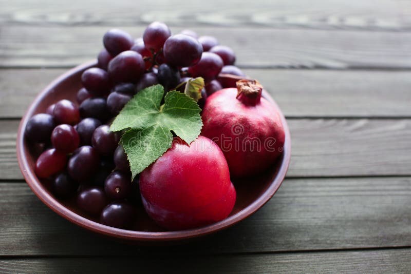 Pomegranates and grapes stock photo. Image of grains - 13671306