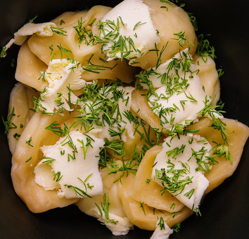 Plate of Tasty Cooked Dumplings on Black Plate Stock Photo - Image of ...