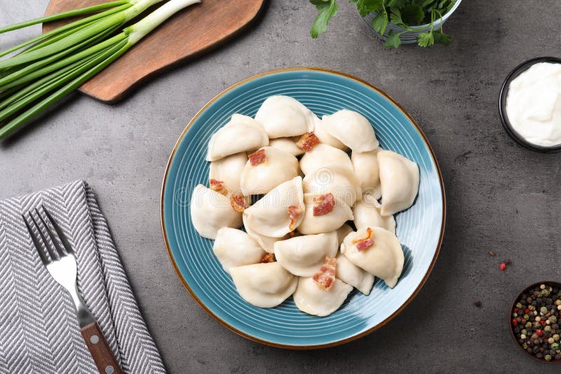 Plate of Tasty Cooked Dumplings Served on Stone Surface Stock Photo ...