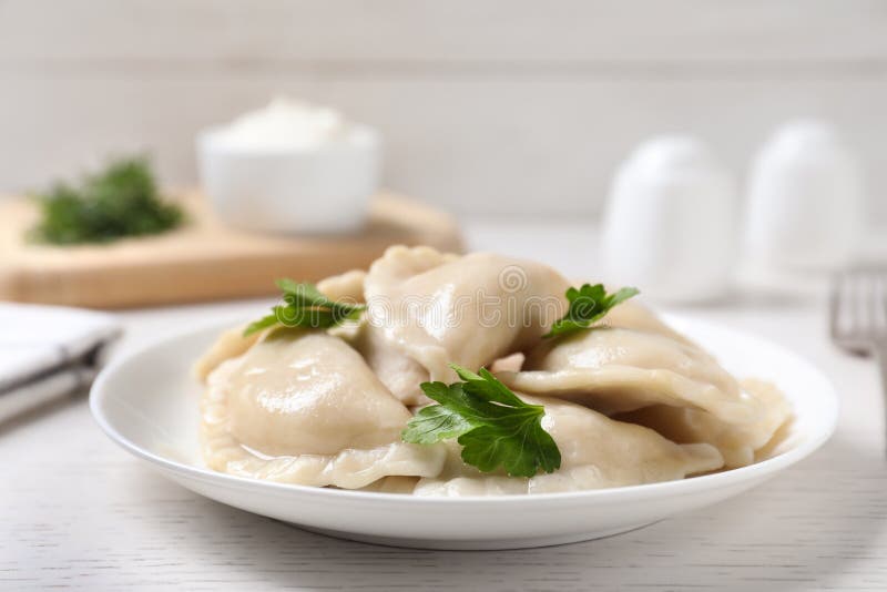 Plate of Tasty Cooked Dumplings Served on White Table Stock Photo ...