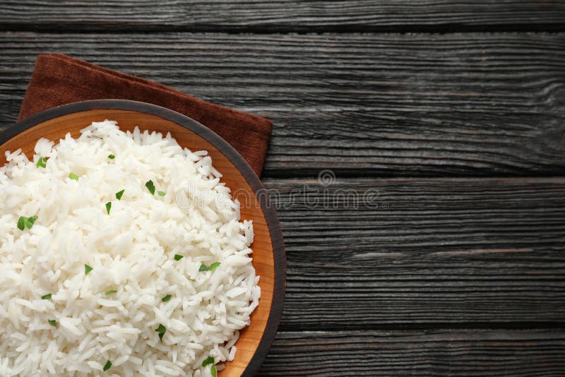 Plate of Tasty Cooked Rice on Wooden Background Stock Image - Image of ...