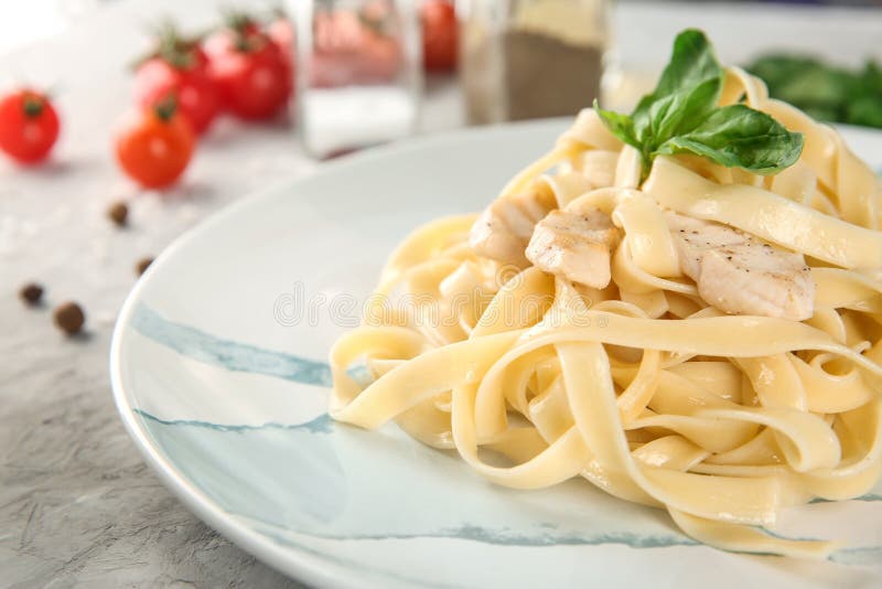 Plate of Tasty Pasta with Chicken Fillet on Table, Closeup Stock Image ...
