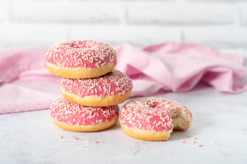 Plate of Vanilla Cake Donuts with Pink Icing and Sprinkles. Stock Image ...