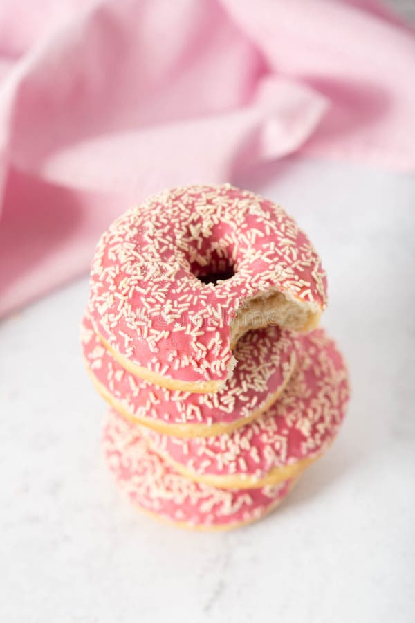 Plate of Vanilla Cake Donuts with Pink Icing and Sprinkles. Stock Photo ...