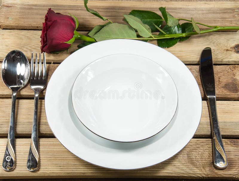 Plate on a Wooden Surface. Decoration Living Flower Rose Stock Image ...