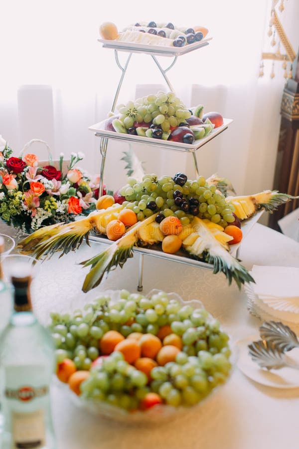 The Plated are Full of Different Fruit Placed on the Stands. Wedding ...