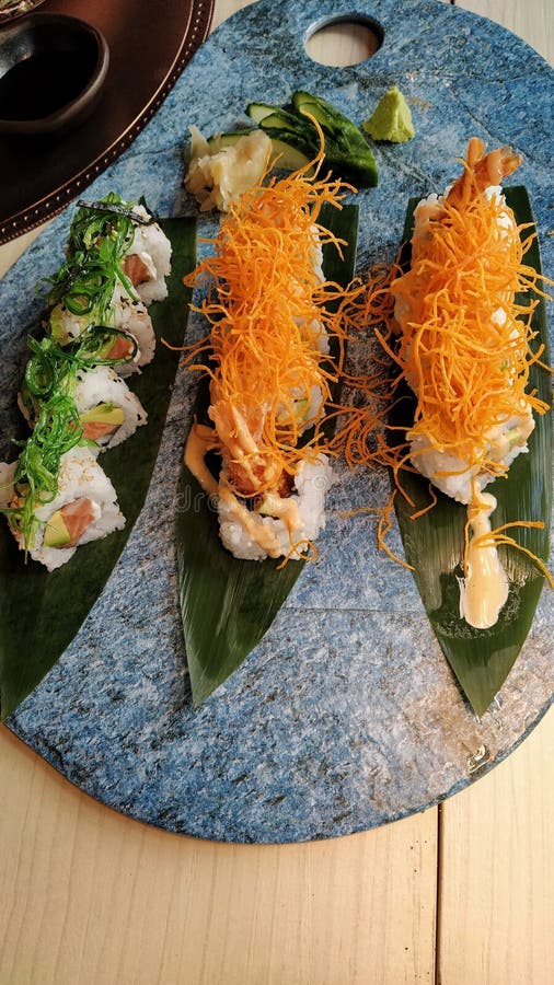 Plated with 3 Rows of Sushi Stock Photo - Image of long, green: 235853600