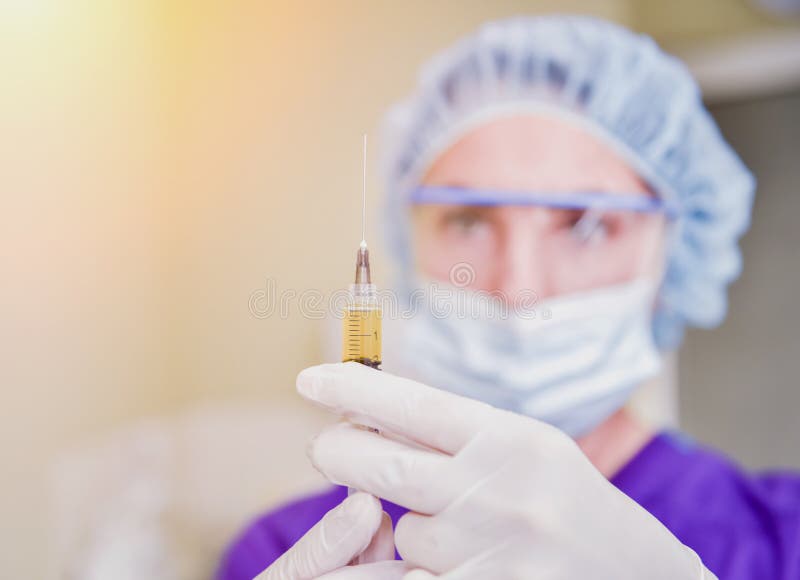 Platelet-Rich Plasma Preparation. Syringe with Plasma in Hands Stock ...