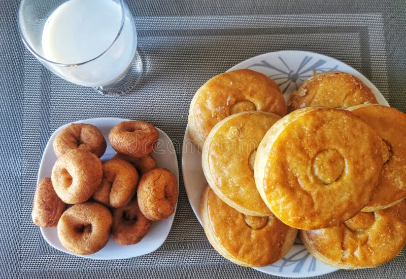 2 Plates with Bread and a Glass of Milk on a Table Stock Image - Image ...