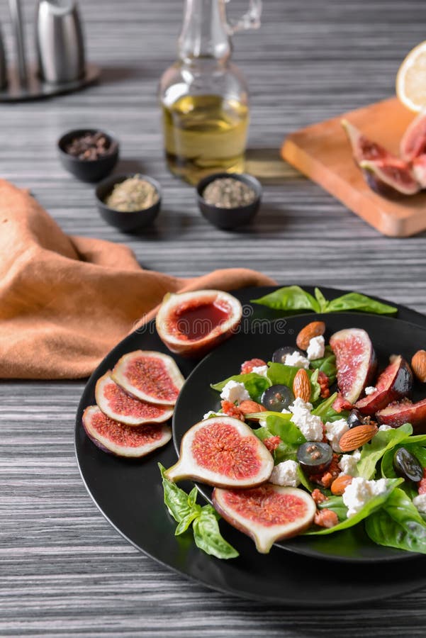 Plates with Delicious Fig Salad on Wooden Table Stock Photo - Image of ...