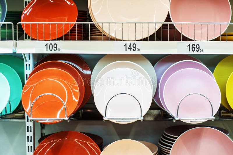 Plates of Different Colors and Sizes on the Display Case. Trade in ...