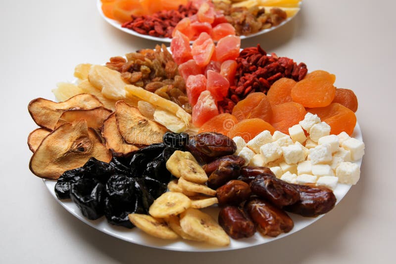 Plates with Different Dried Fruits on White Background Stock Image ...