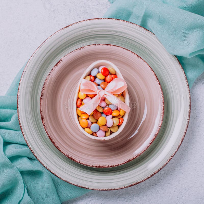 Plates with Easter Chocolate Eggs with Colorful Candies, Table Setting ...