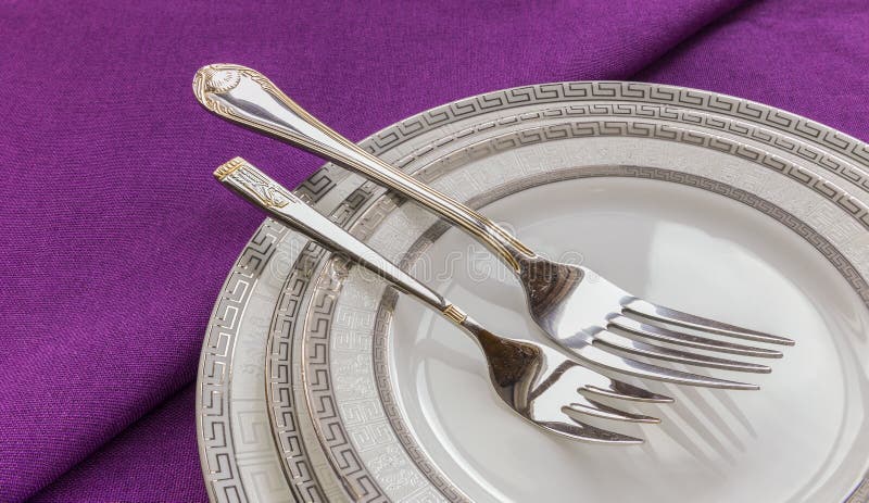 Plates and Forks on the Table Stock Photo - Image of colors, elegance ...