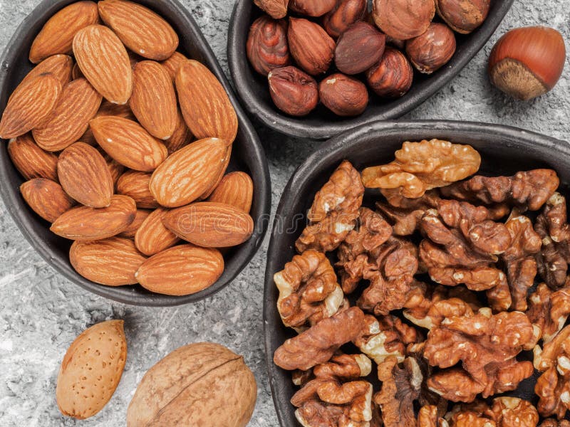 Plates with nuts close up stock image. Image of diet - 90471827