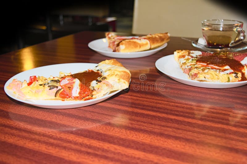 Pizza on a Plate on a Table in a Cafe Stock Image - Image of meat ...