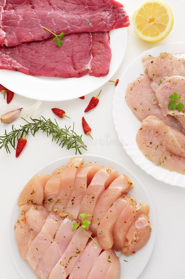 Plates with Raw Meat on a White Table Stock Image - Image of diet ...