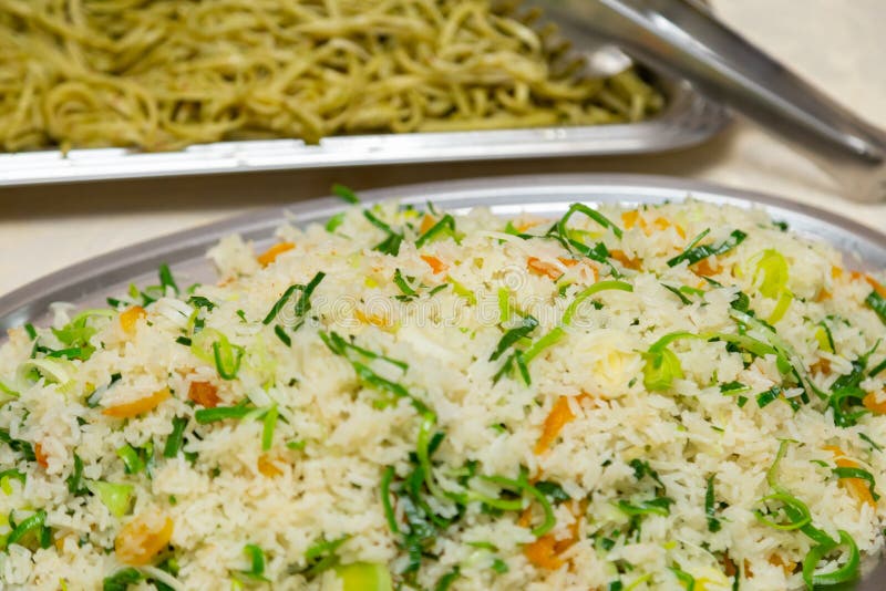 Plates with Rice and Pasta on a Buffet Table. Stock Image - Image of ...