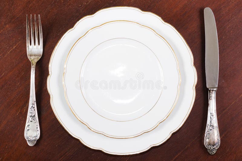 Plates with silverware stock image. Image of arrangement - 25377465