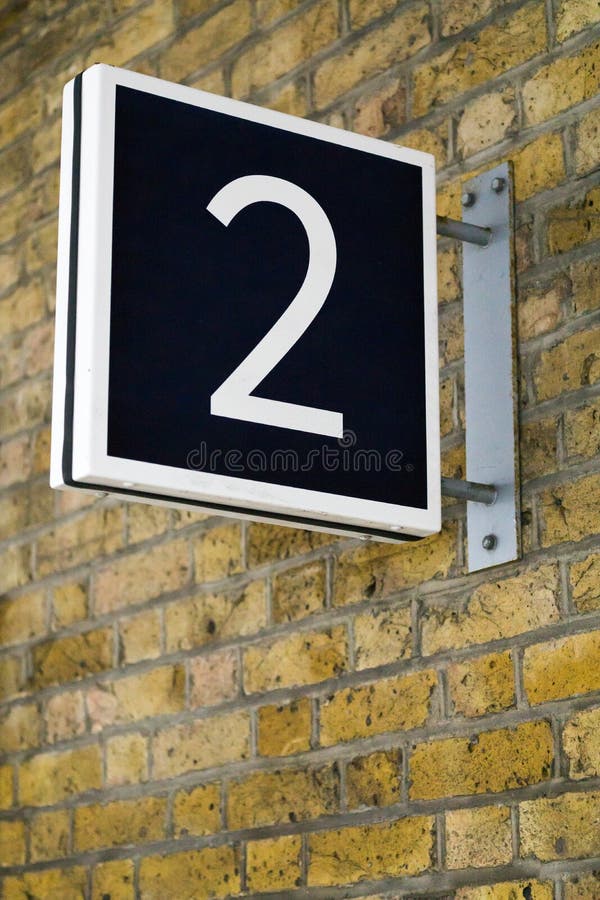 Platform 2 Sign Against Brick Wall Stock Image - Image of train, people ...