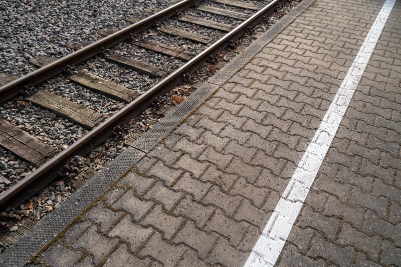 Platform of a Train Station with Rails Stock Image - Image of pavement ...