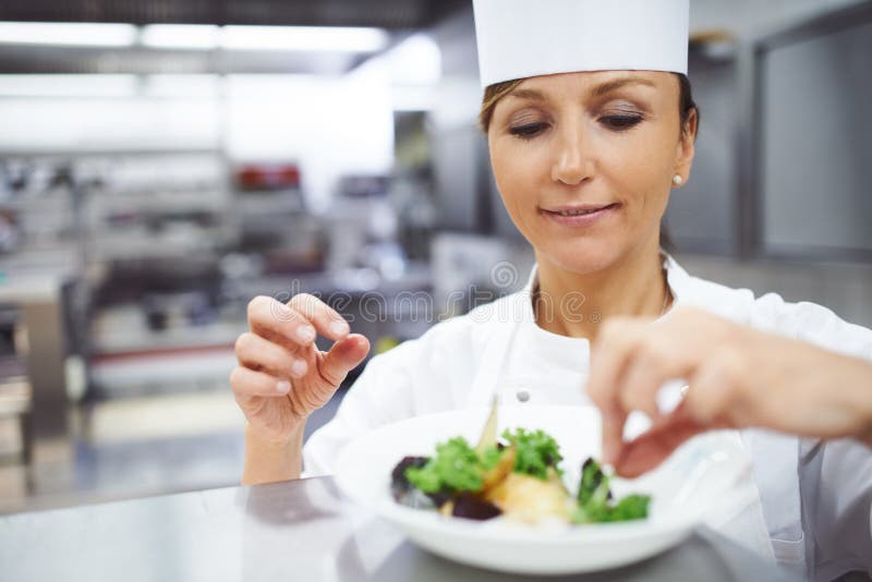 Plating is an Art. a Chef Putting the Final Touches on a Dinner Plate ...