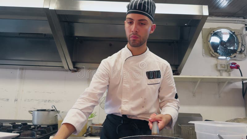 Plating of a Raw and Cooked Fish Based Appetizer in a Luxury Italian ...