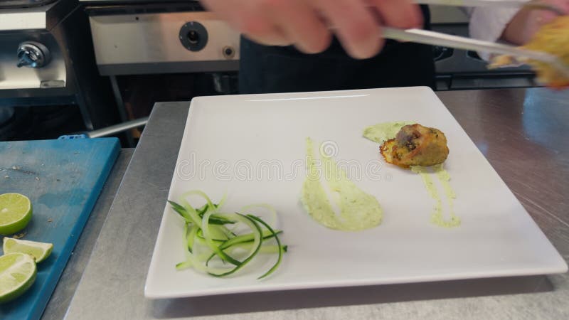 Plating of a Raw and Cooked Fish Based Appetizer in a Luxury Italian ...