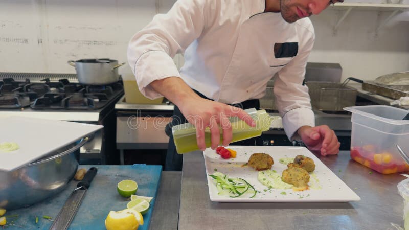 Plating of a Raw and Cooked Fish Based Appetizer in a Luxury Italian ...