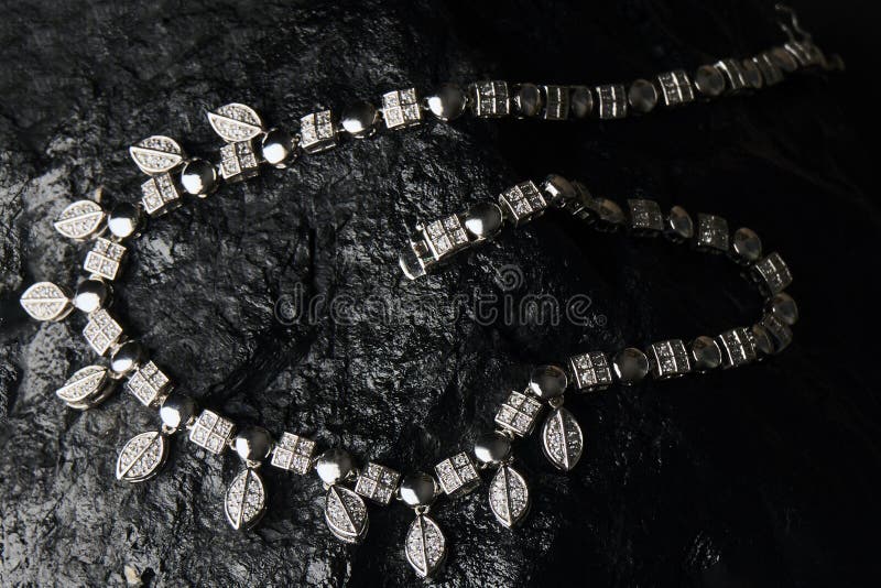 Platinum Necklace with Diamonds on Black Background with Copy Space ...