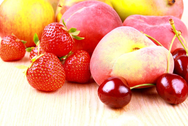 Platt Peach, Cherries, Strawberries, Lemon and Mango Stock Image ...