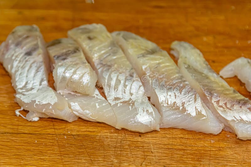 A Platter with Sliced Fresh Fish and Ingredients To Cook it on the ...