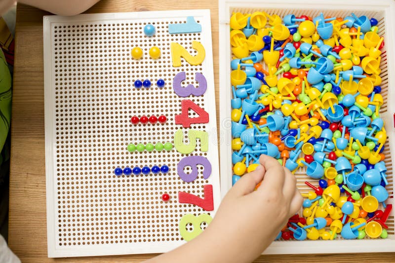 By Provided Numbers Boy Inserting Pins. Stock Photo - Image of hand ...