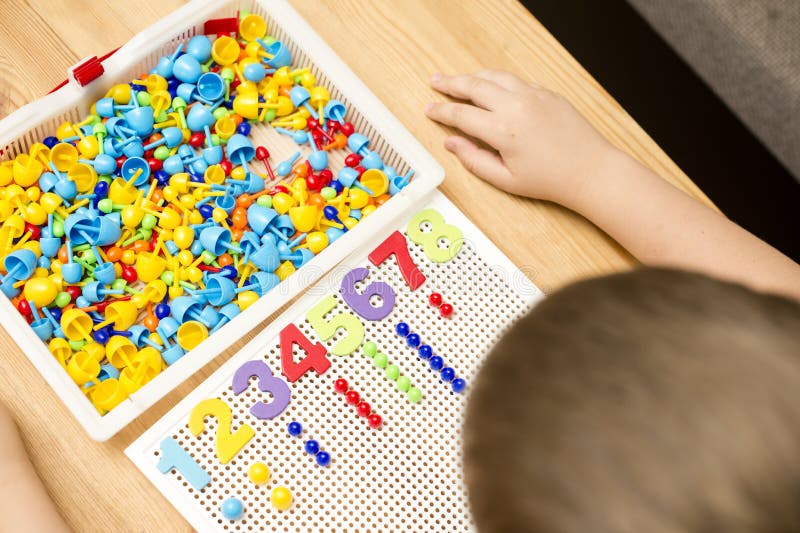 By Provided Numbers Boy Inserting Pins. Stock Photo - Image of lesson ...