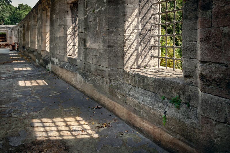 Play of Light and Shadow of a Row of Barred Antique Windows. Ancient ...
