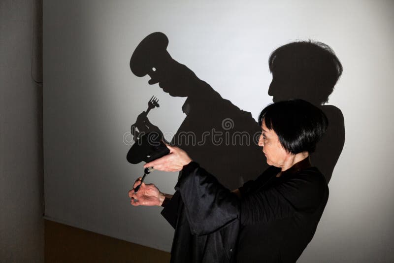 Play Shadow Projected Against a White Background, a Cook Stock Photo ...
