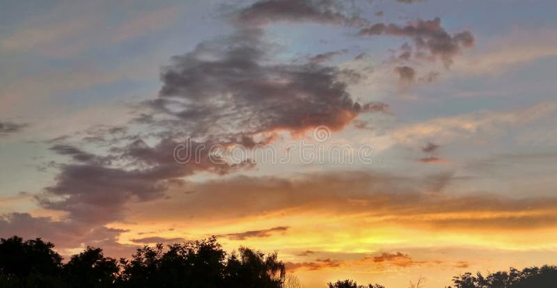 Play of Sunlight in the Clouds at Sunset Stock Photo - Image of dusk ...