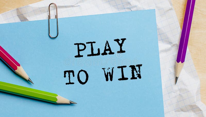 PLAY TO WIN Text Written on a Paper with Pencils in Office Stock Image ...