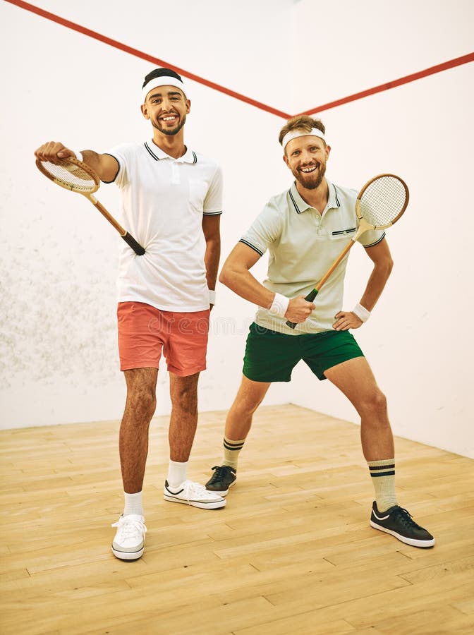 Play To Your Strengths. Two Young Men Playing a Game of Squash. Stock ...