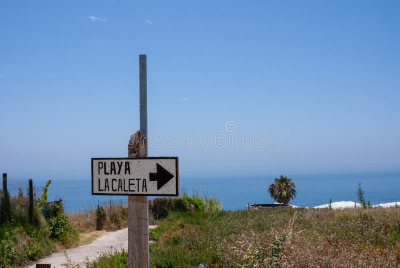 Playa La Caleta Beach Sign in Nerja, Maro, Spain Stock Photo - Image of ...