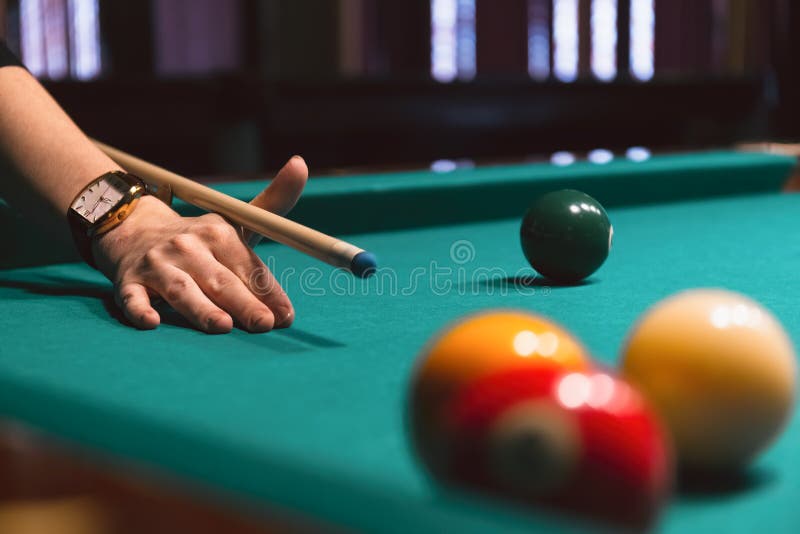 Player Holding Que and Aiming To Billiard White Ball. White Ball on ...