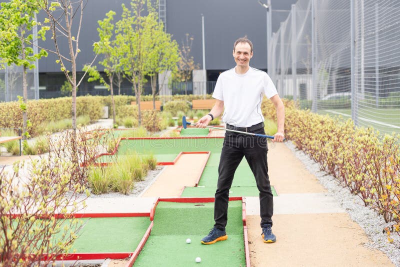 Player Looks at His Hit on a Mini Golf Course Stock Photo - Image of ...