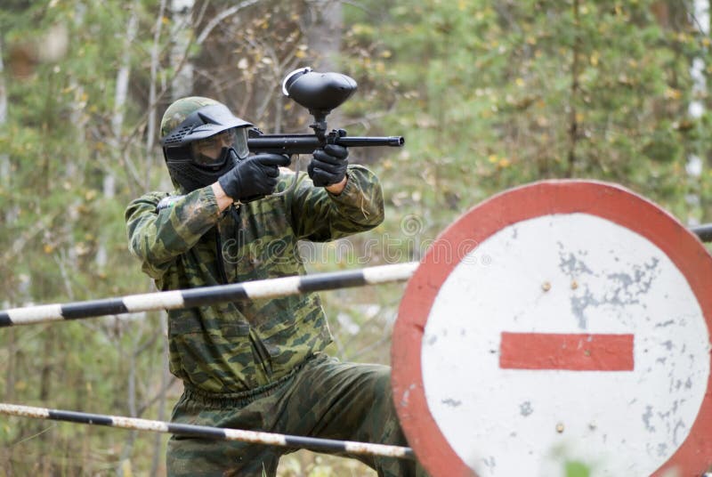 Paintball player shooting stock photo. Image of competitive - 6030314
