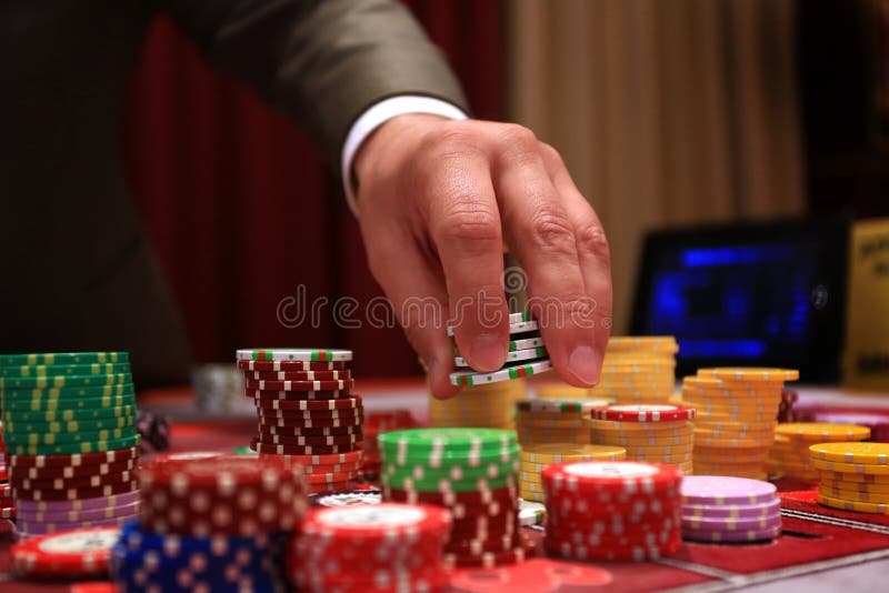 Player Placing Chips on a Gambling Table in Casino Stock Photo - Image ...