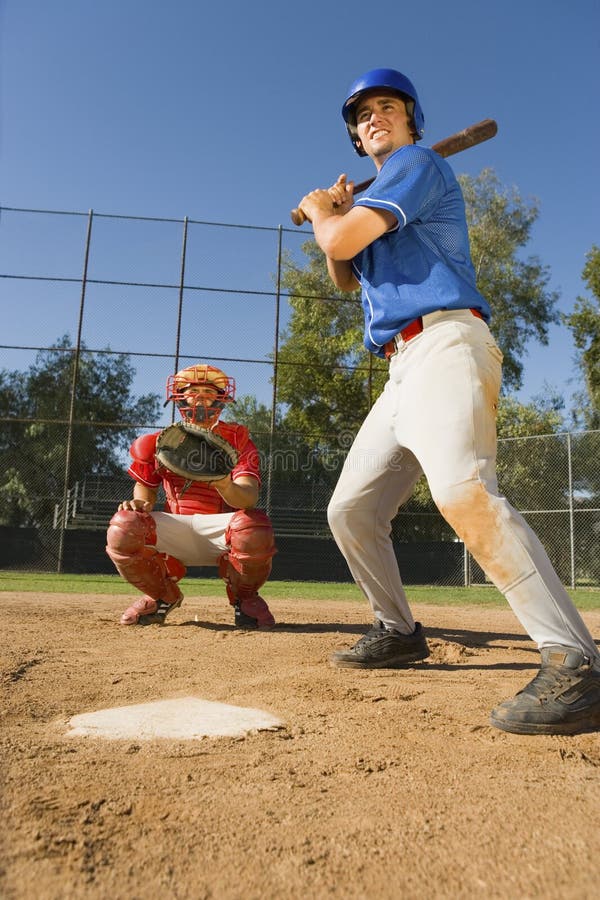 Player Holding Baseball Bat Stock Image - Image of outdoors, player ...