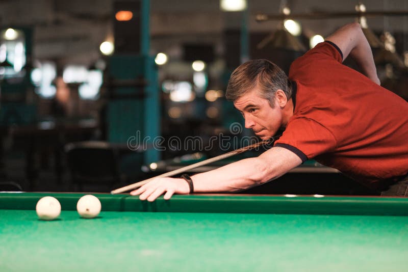 The Player Takes Aim at the Ball in Billiards Stock Image - Image of ...
