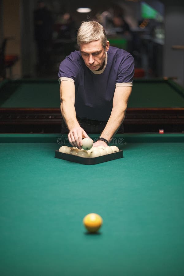 The Player Takes Aim at the Ball in Billiards Stock Image - Image of ...